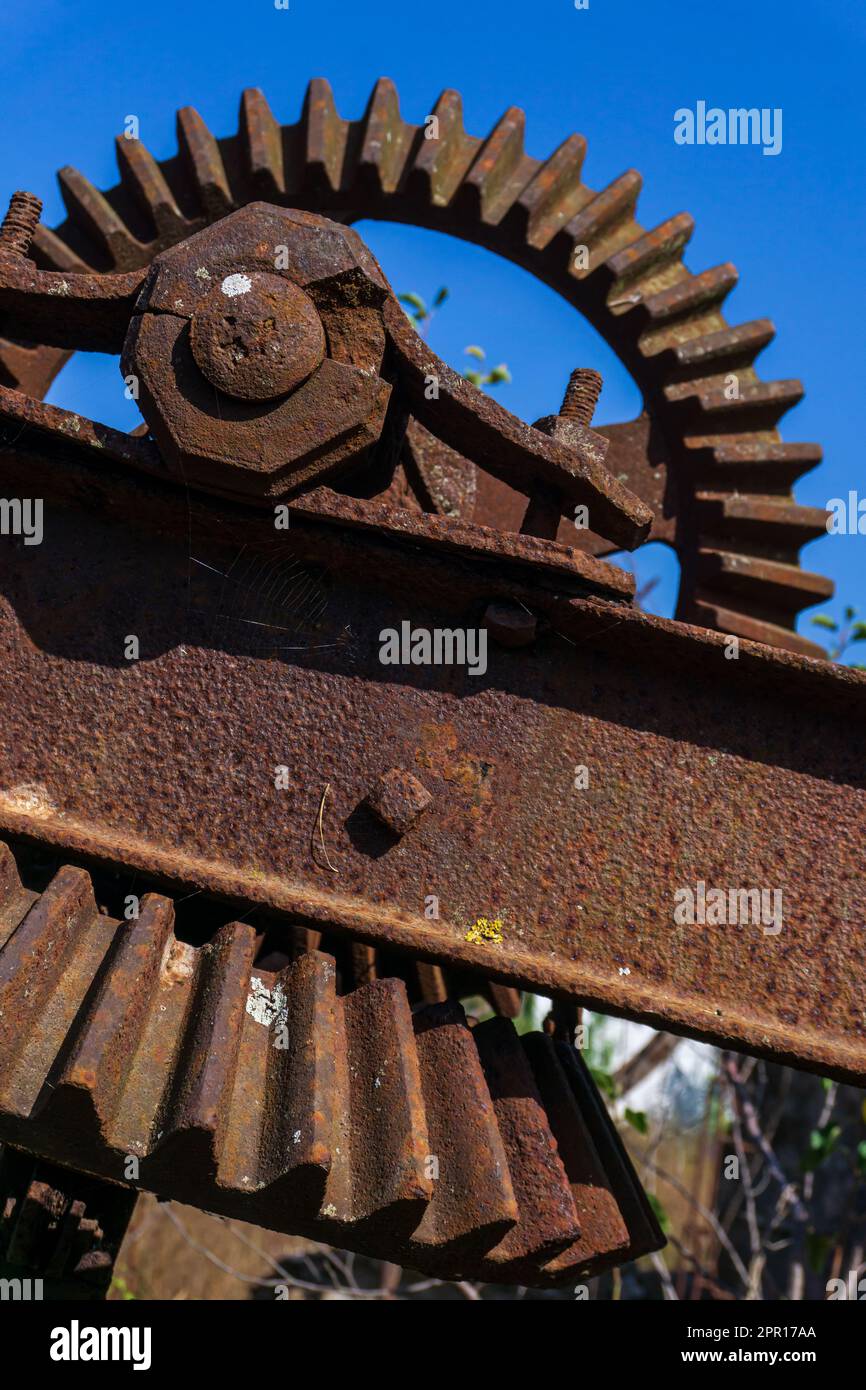 Old rusty gears details of the mechanism of an old abandoned mill close ...