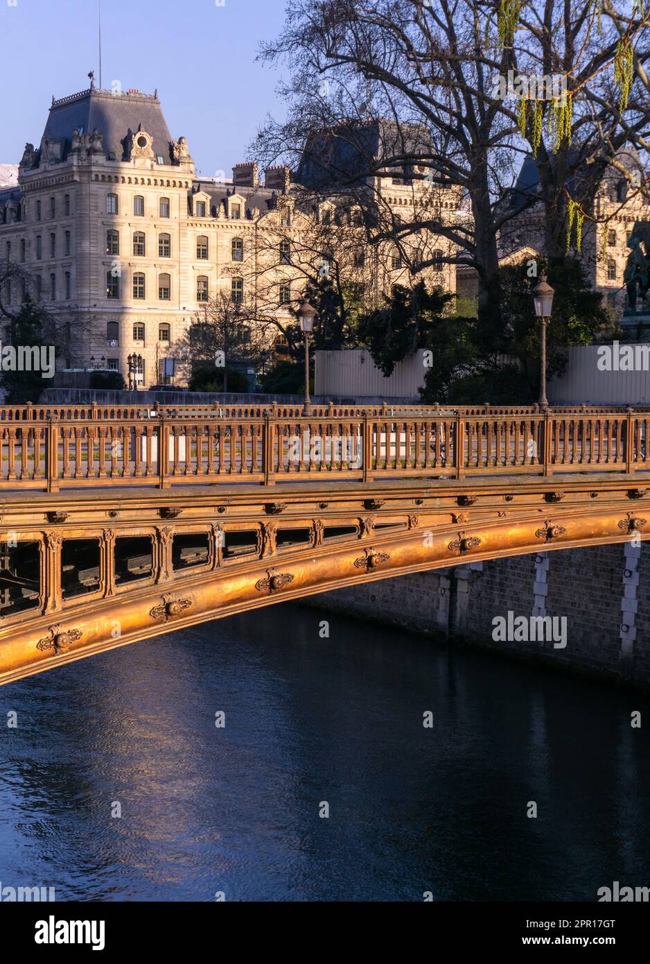 Bridge Pont au Double across the Seine on a sunny morning in Paris ...