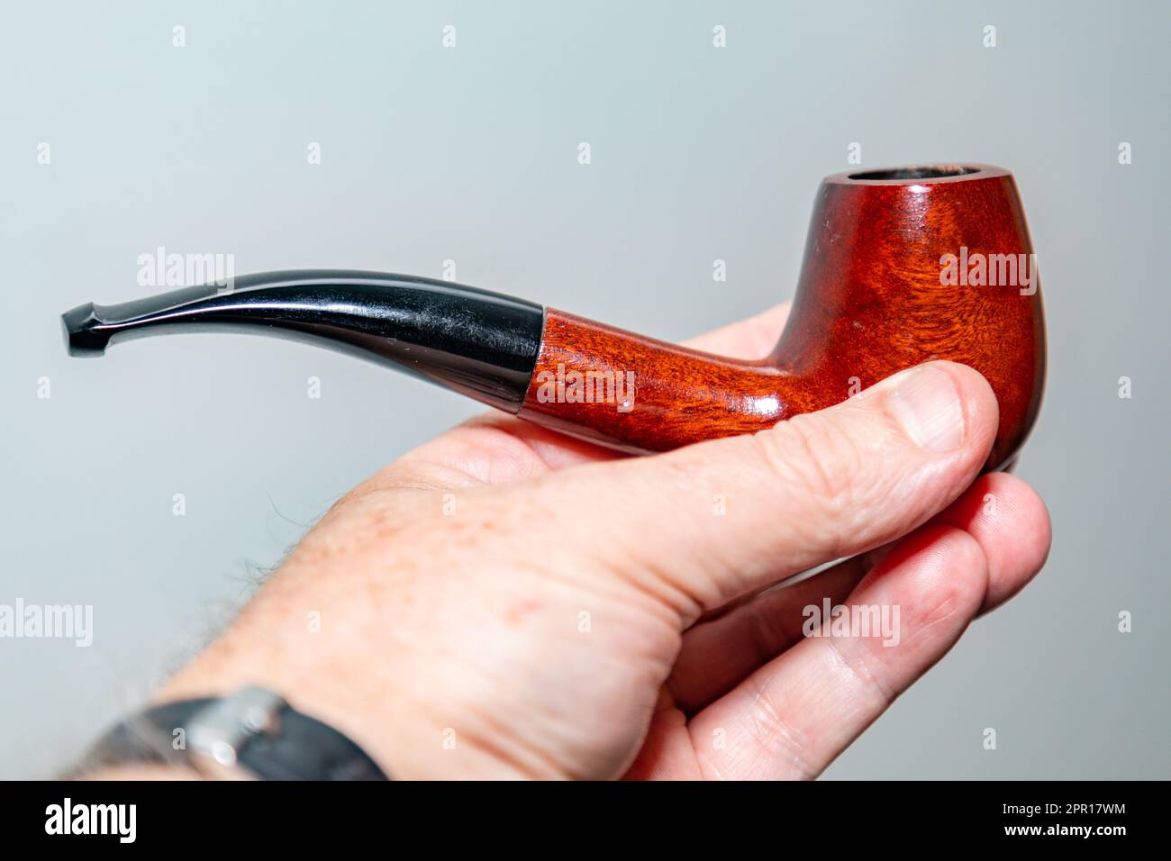 Traditional pipe isolated on light background Stock Photo - Alamy