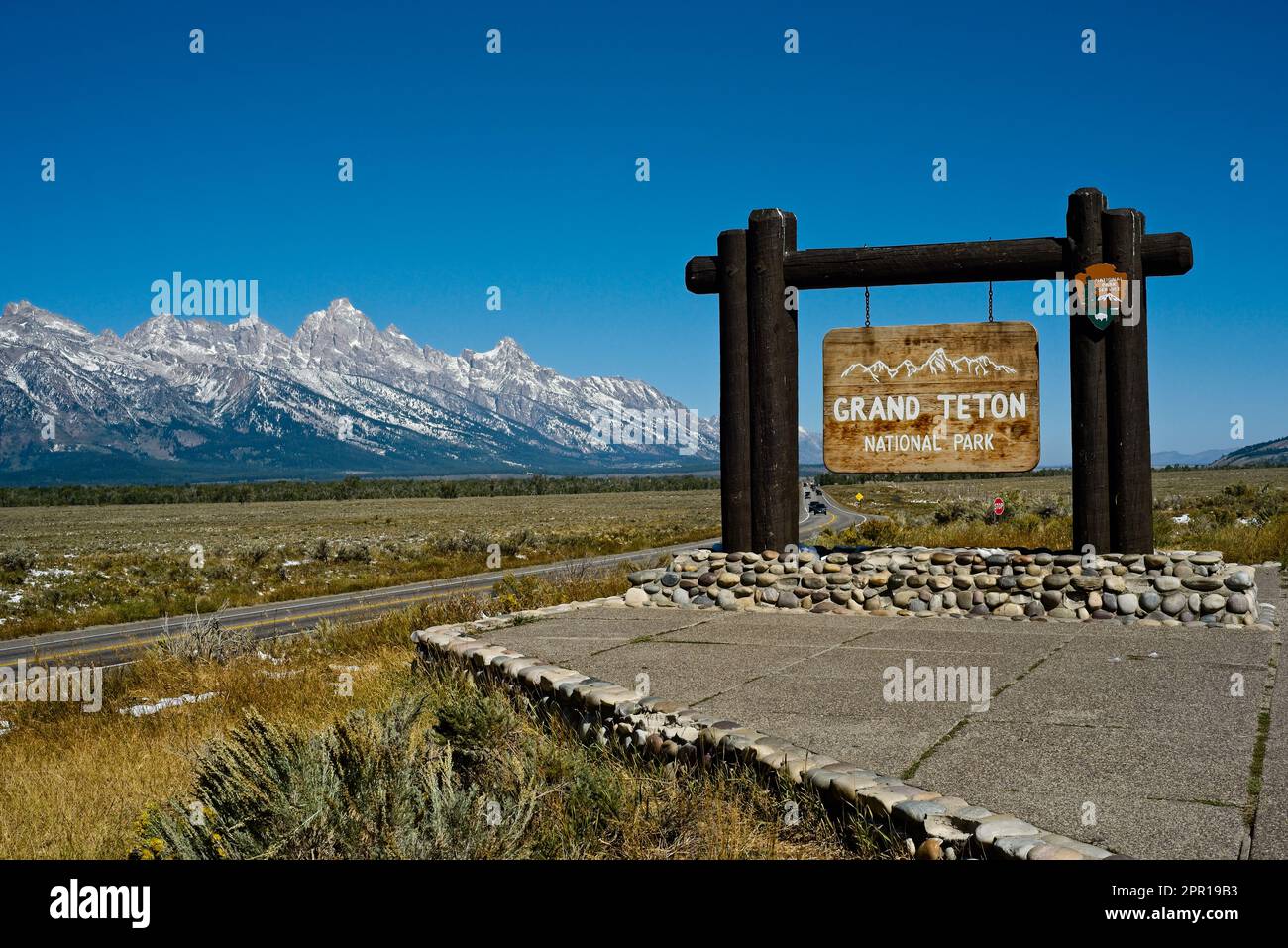 Grand Teton National Park sign beside US 191 North, with the Teton ...