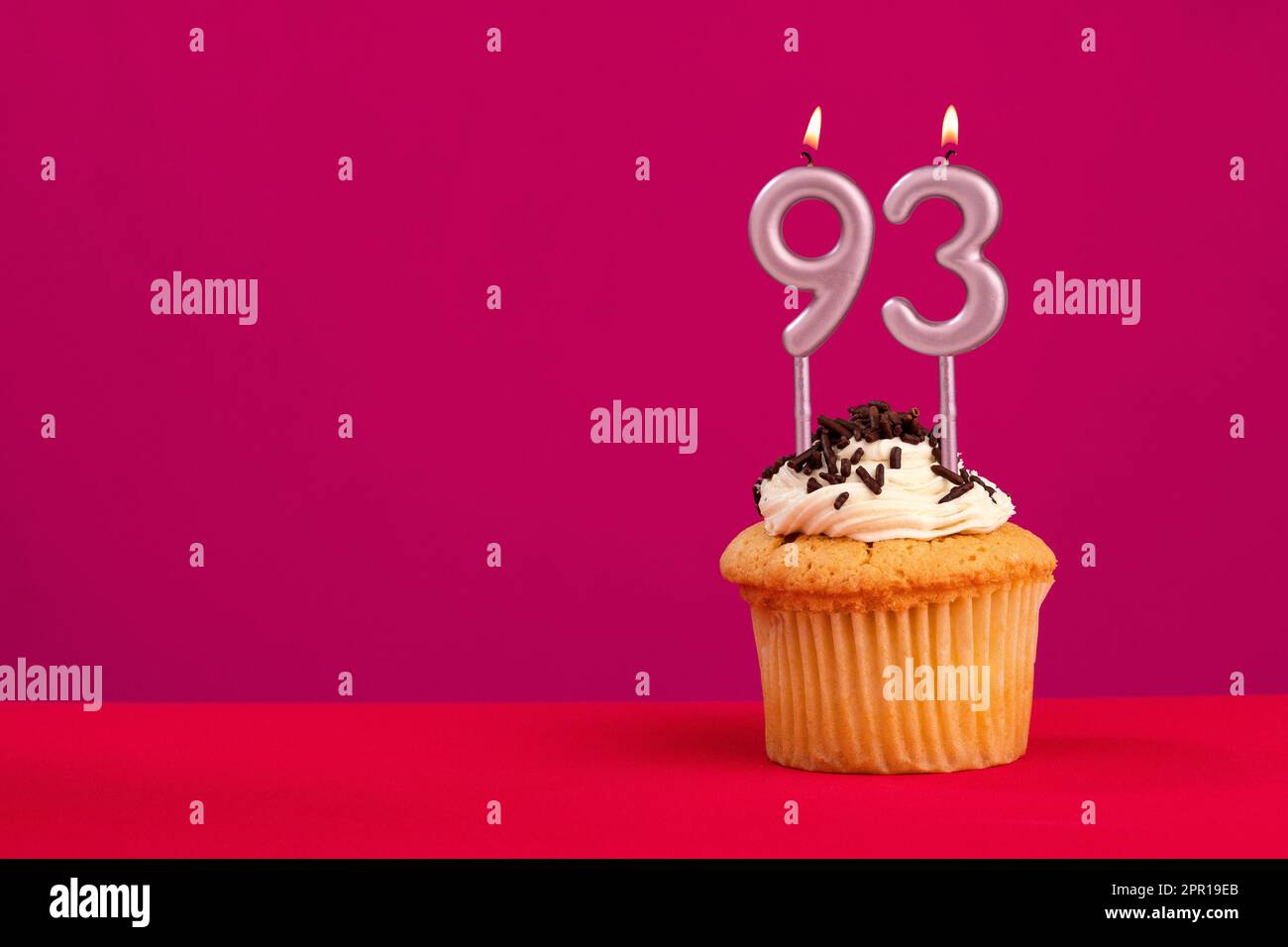 Birthday cake with candle number 93 - Rhodamine Red foamy background ...