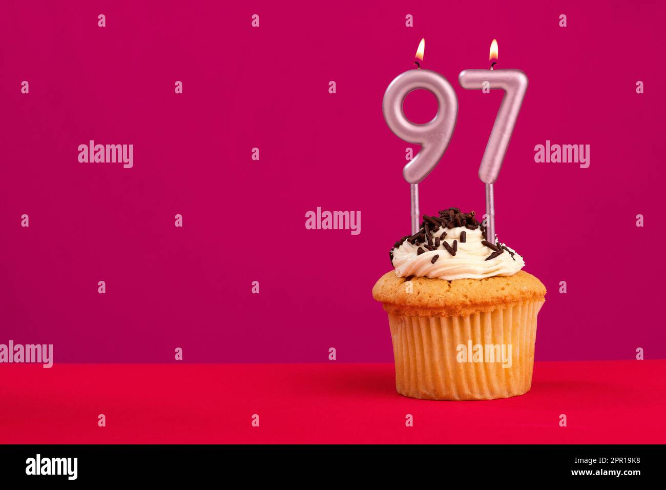 Birthday cake with candle number 97 - Rhodamine Red foamy background ...