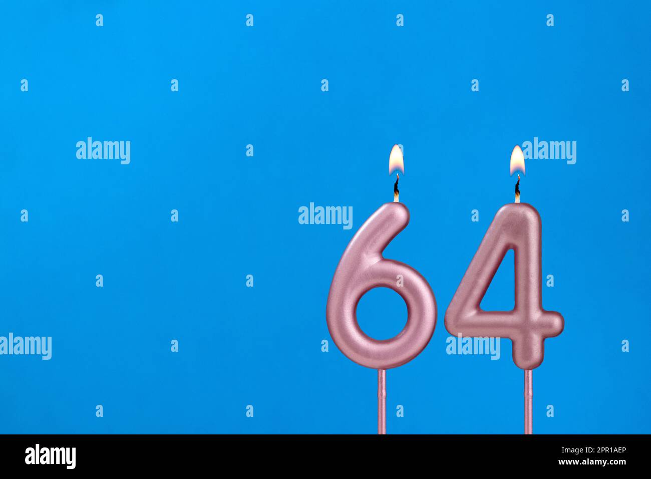 Candle number 64 - Birthday in blues foamy background Stock Photo - Alamy