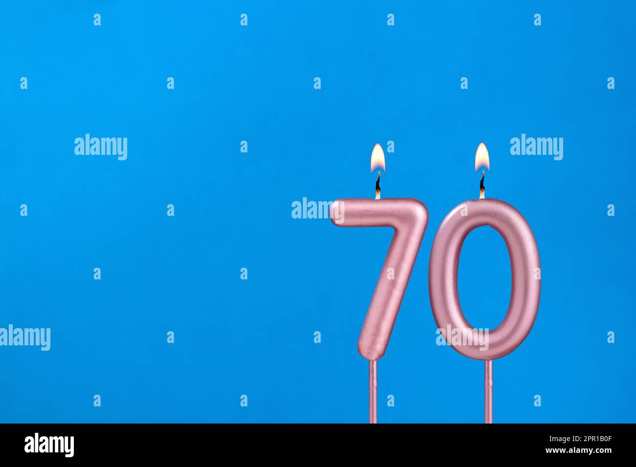 Candle number 70 - Birthday in blues foamy background Stock Photo - Alamy