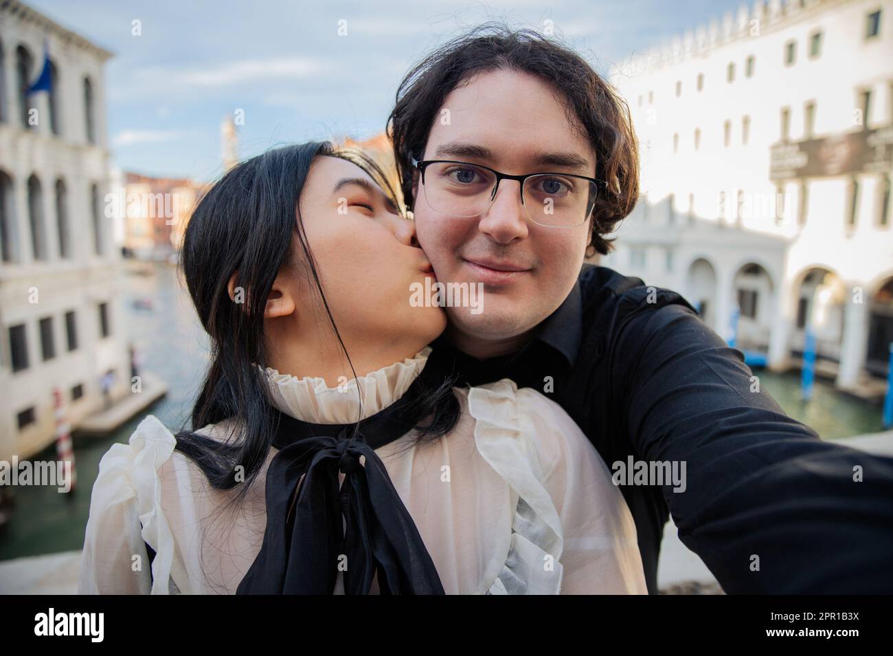 Couple kiss on cheek italy hi-res stock photography and images - Alamy
