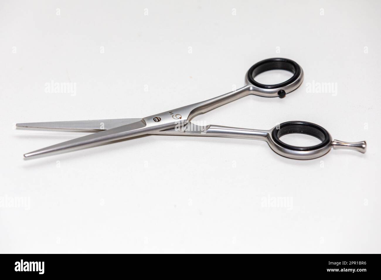 Traditional metallic scissors isolated on white background Stock Photo ...