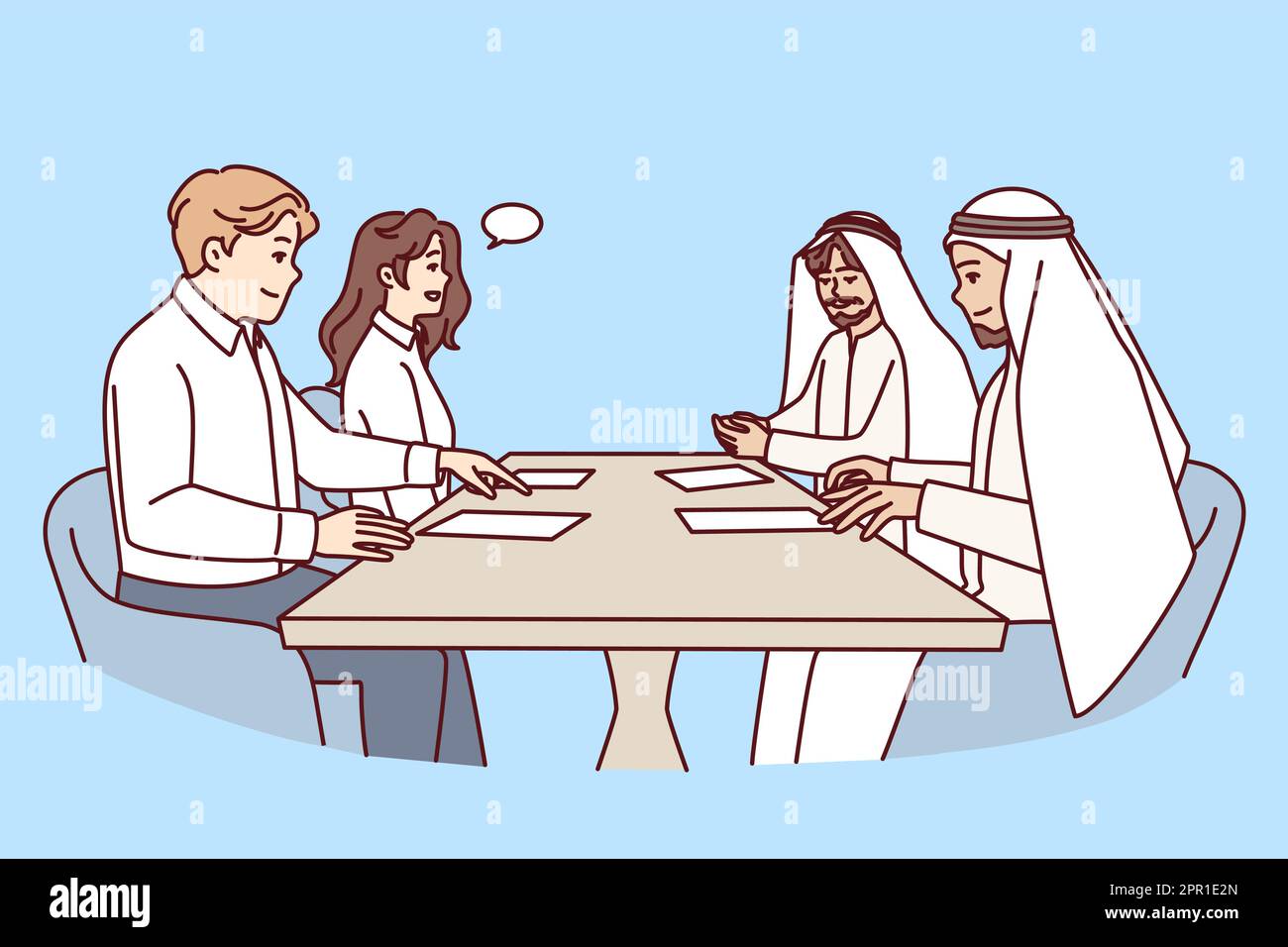 Managers of international business sit at table with papers and discuss ...