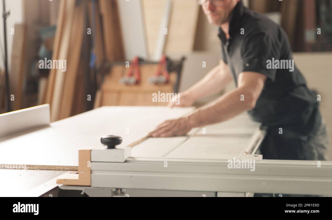 Craftsman at work in his own workshop. One man works with proper tools ...