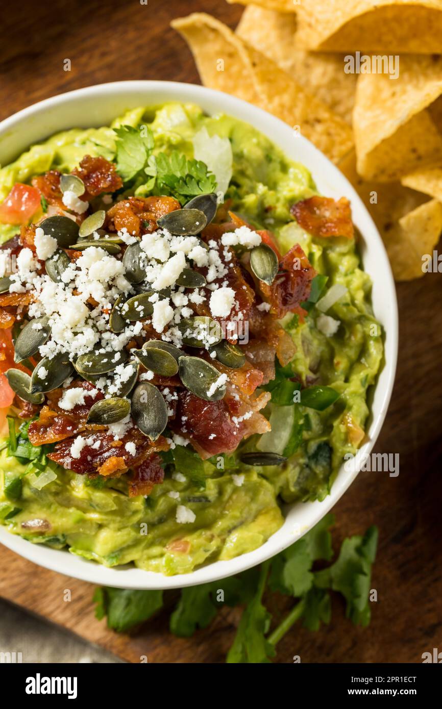 Homemade Gourmet Fancy Guacamole with Bacon Pepitas and Queso Fresco ...