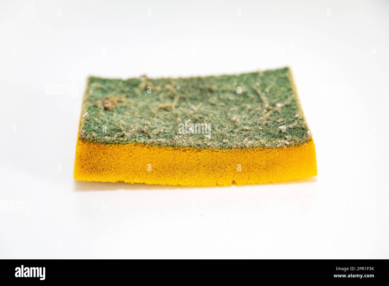 Two-sided cleaning sponge, used and worn Stock Photo - Alamy