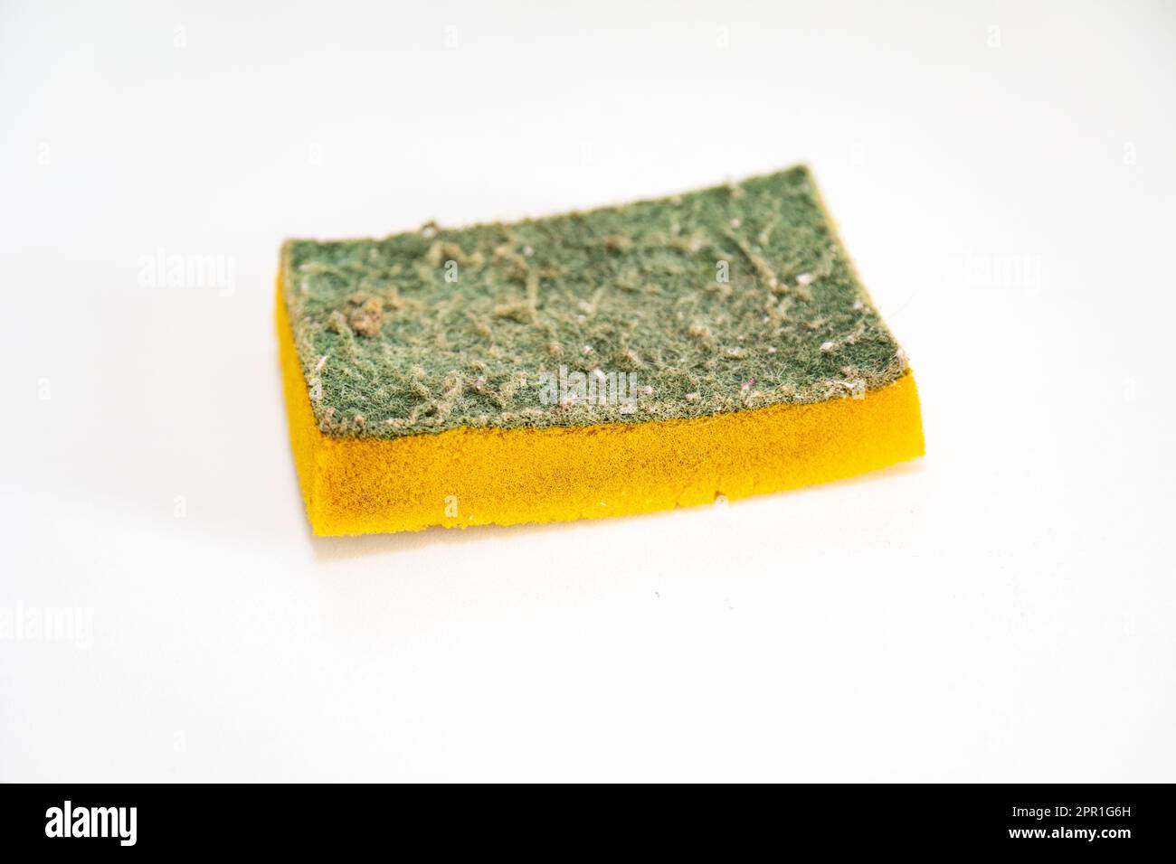 Two-sided cleaning sponge, used and worn Stock Photo - Alamy