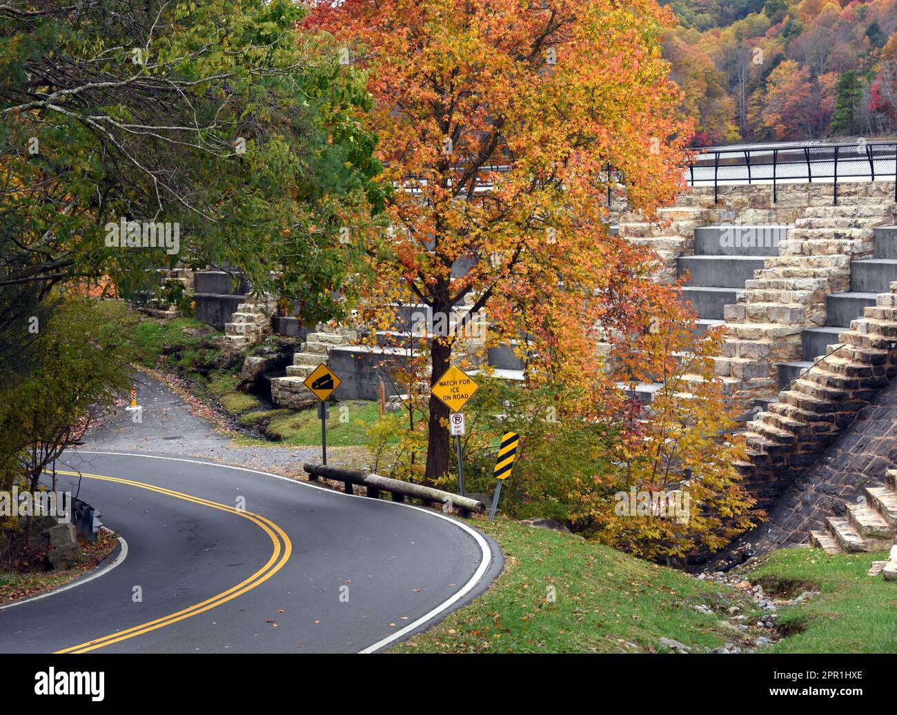 Curving entrance to Bays Mountain Park has signs warning of steep ...