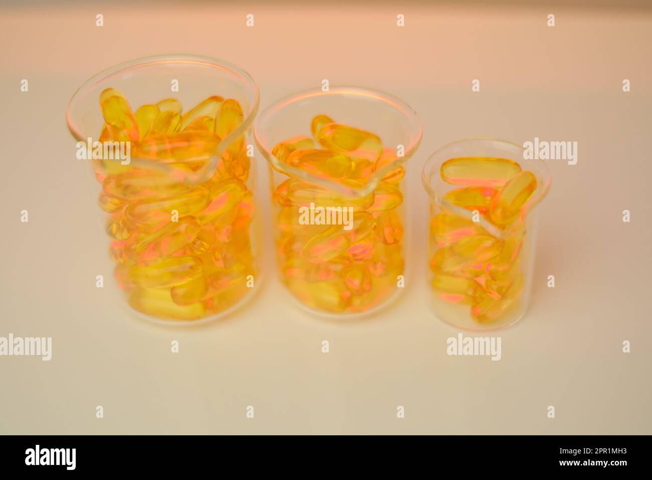 Fish oil capsules in transparent flasks . omega fatty acids oil ...