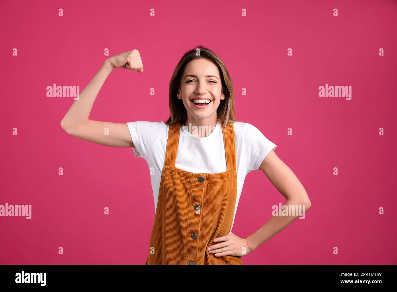 Strong woman as symbol of girl power on pink background. 8 March ...