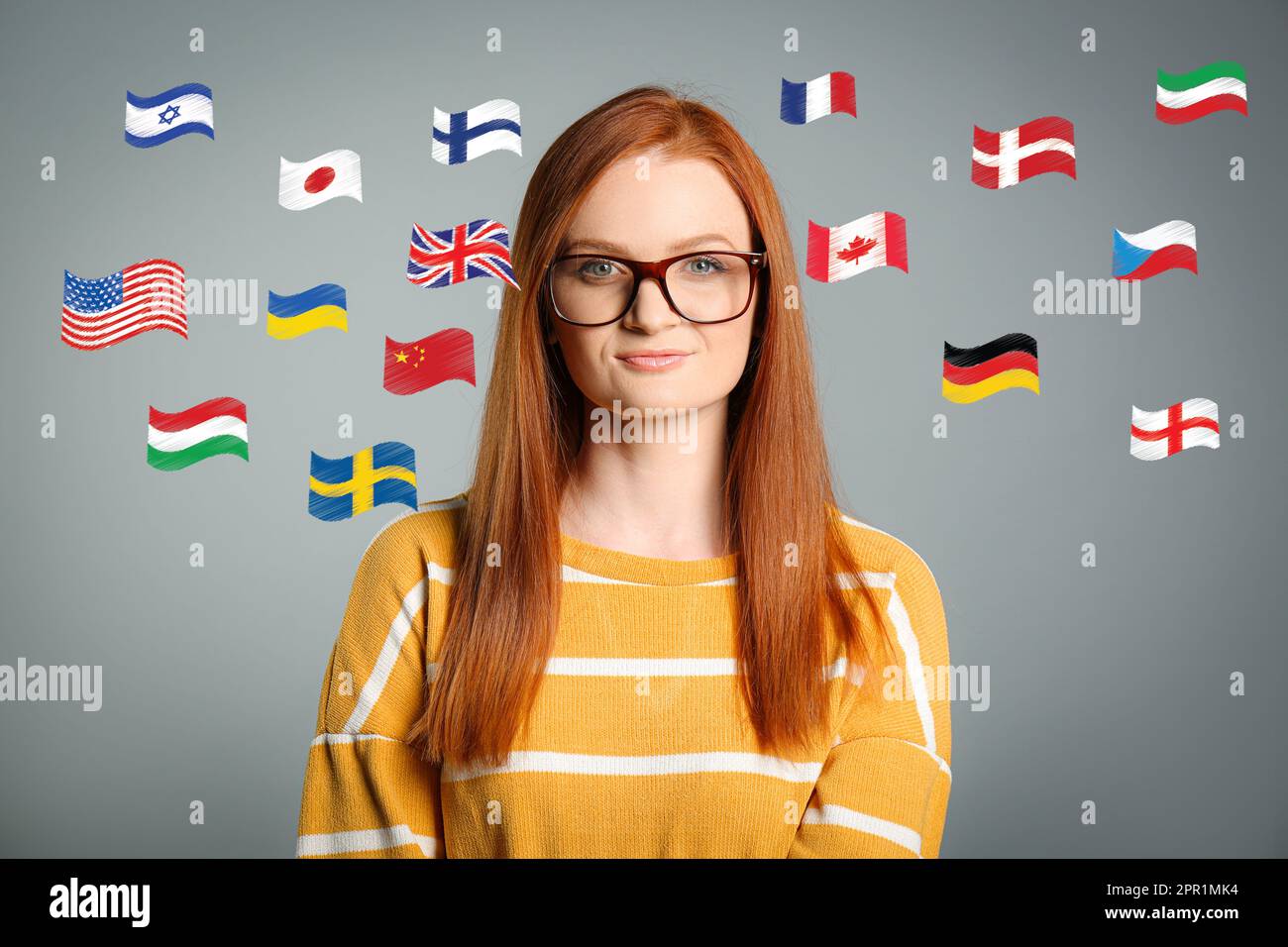 Portrait of interpreter and flags of different countries on grey ...