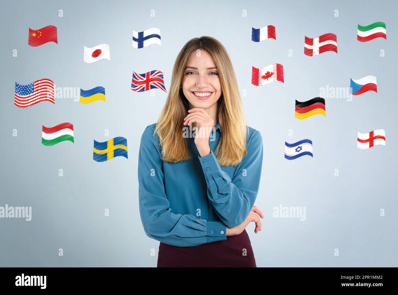 Portrait of interpreter and flags of different countries on light blue ...