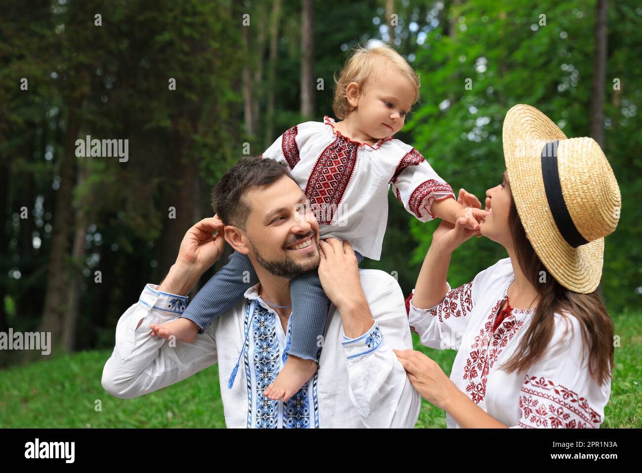 Happy family in Ukrainian national clothes outdoors Stock Photo - Alamy