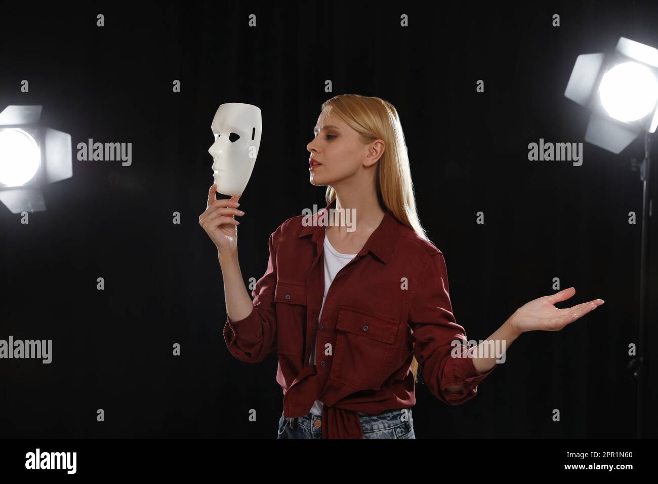 Professional actress rehearsing with mask on stage in theatre Stock ...