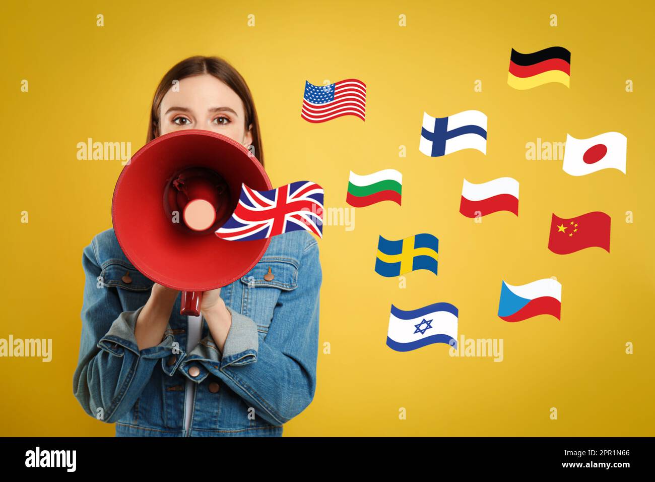Portrait of interpreter with megaphone and flags of different countries ...