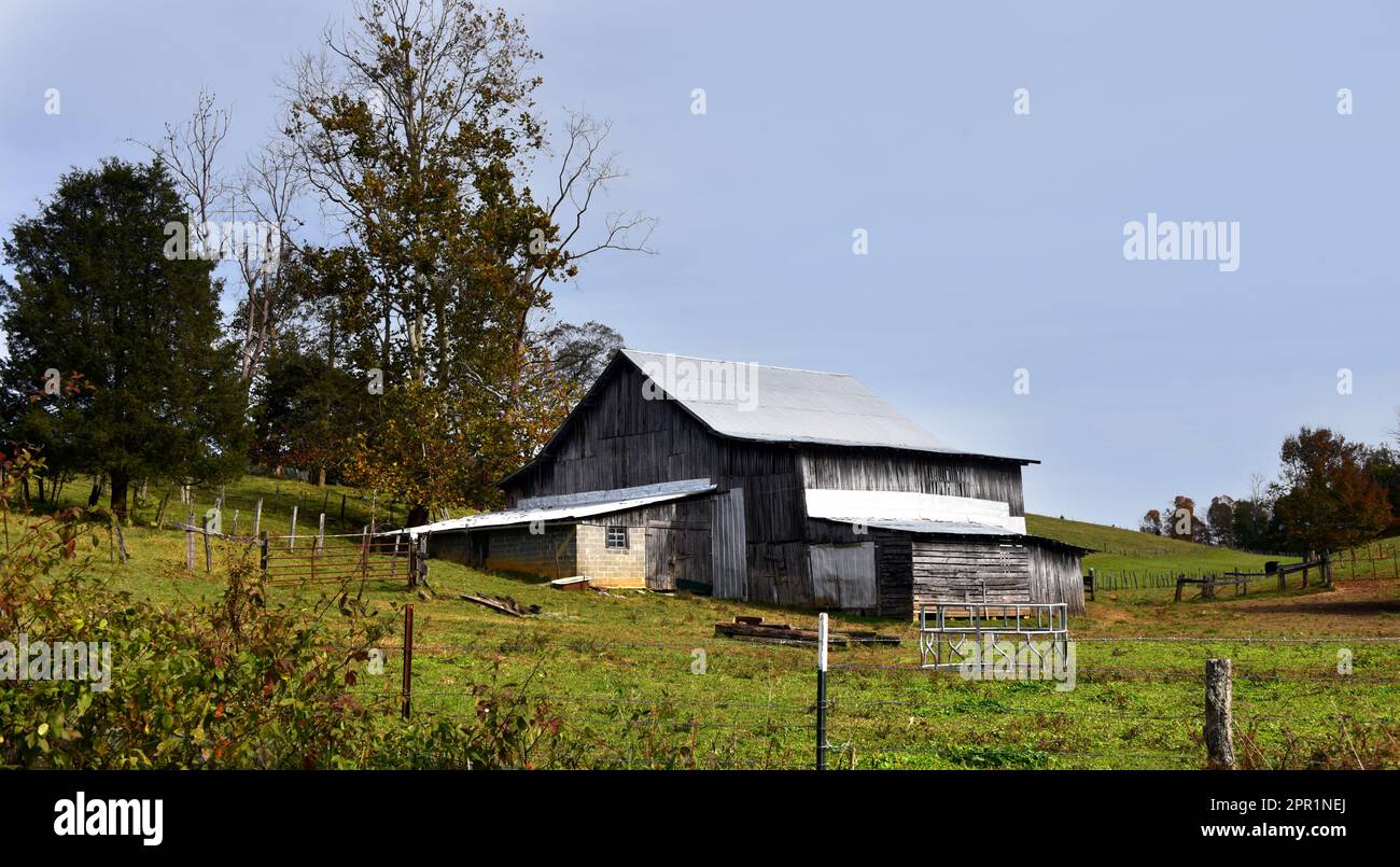 Weathered, wooden barn sits on a hillside in the Appalachian Mountains ...