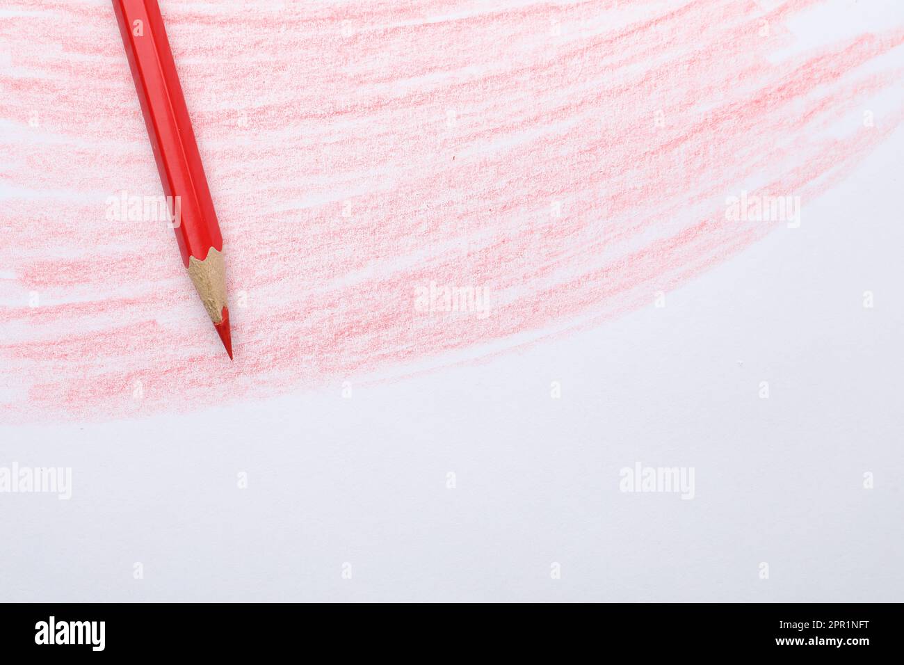 Red pencil on sheet of paper with drawing, top view Stock Photo - Alamy