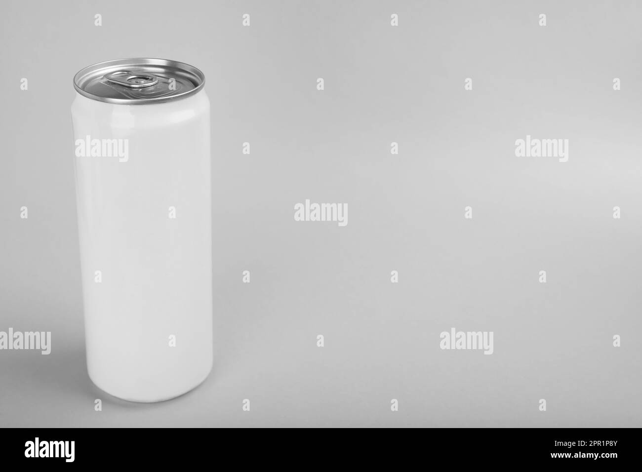 White can of energy drink on light grey background. Space for text ...