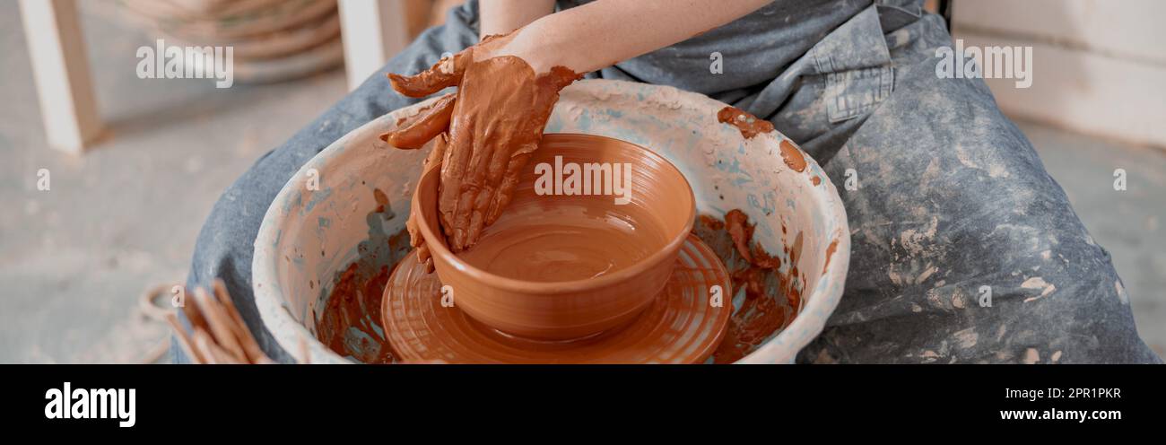 Young potter works in workshop hi-res stock photography and images - Alamy