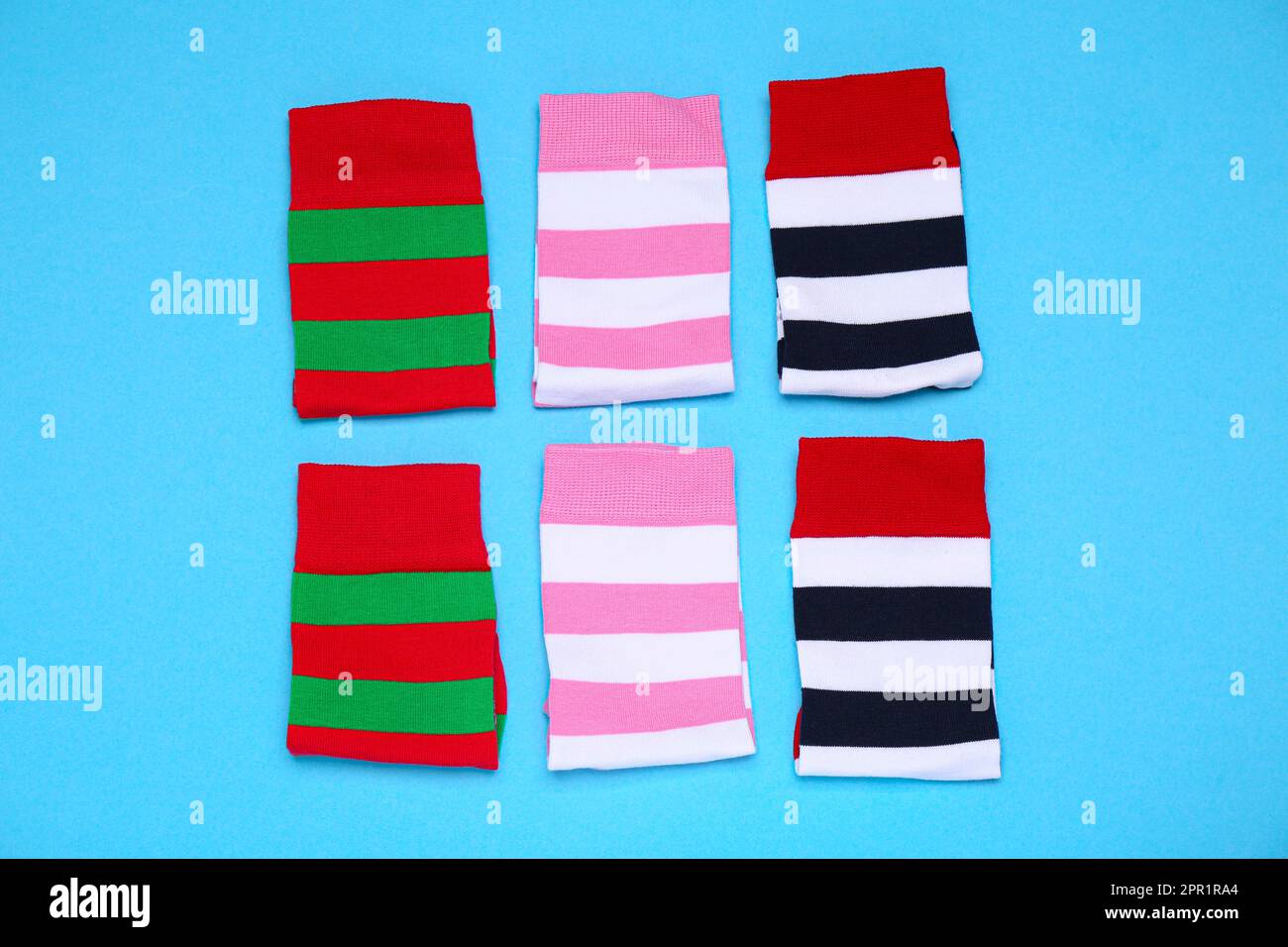 Different striped socks on light blue background, flat lay Stock Photo ...