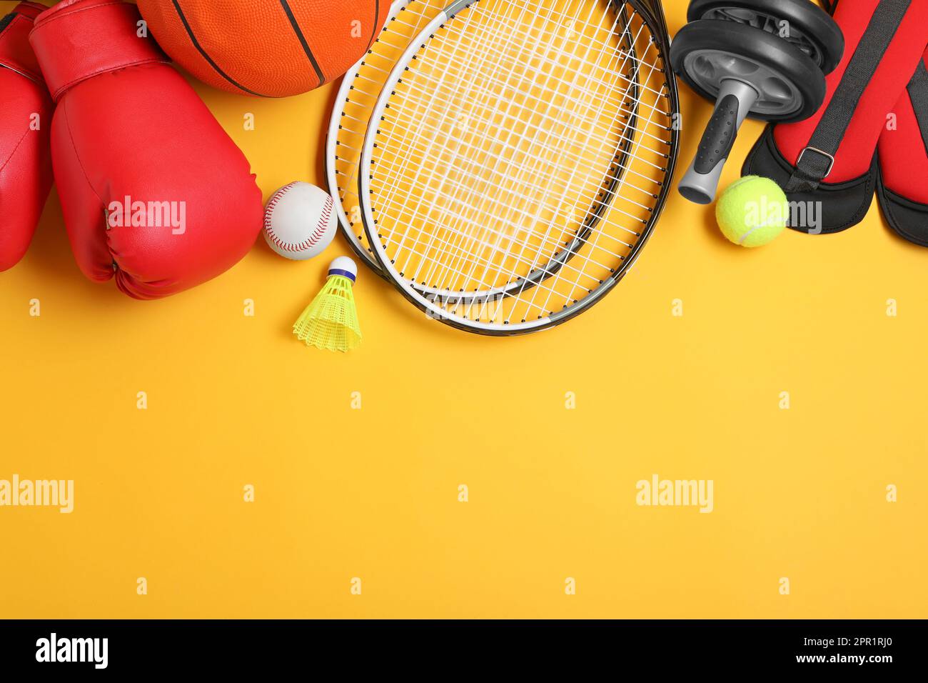 Set of different sports equipment on yellow background, flat lay. Space ...