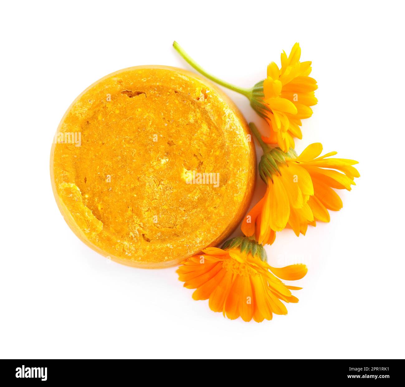 Yellow solid shampoo bar and flowers on white background, top view ...