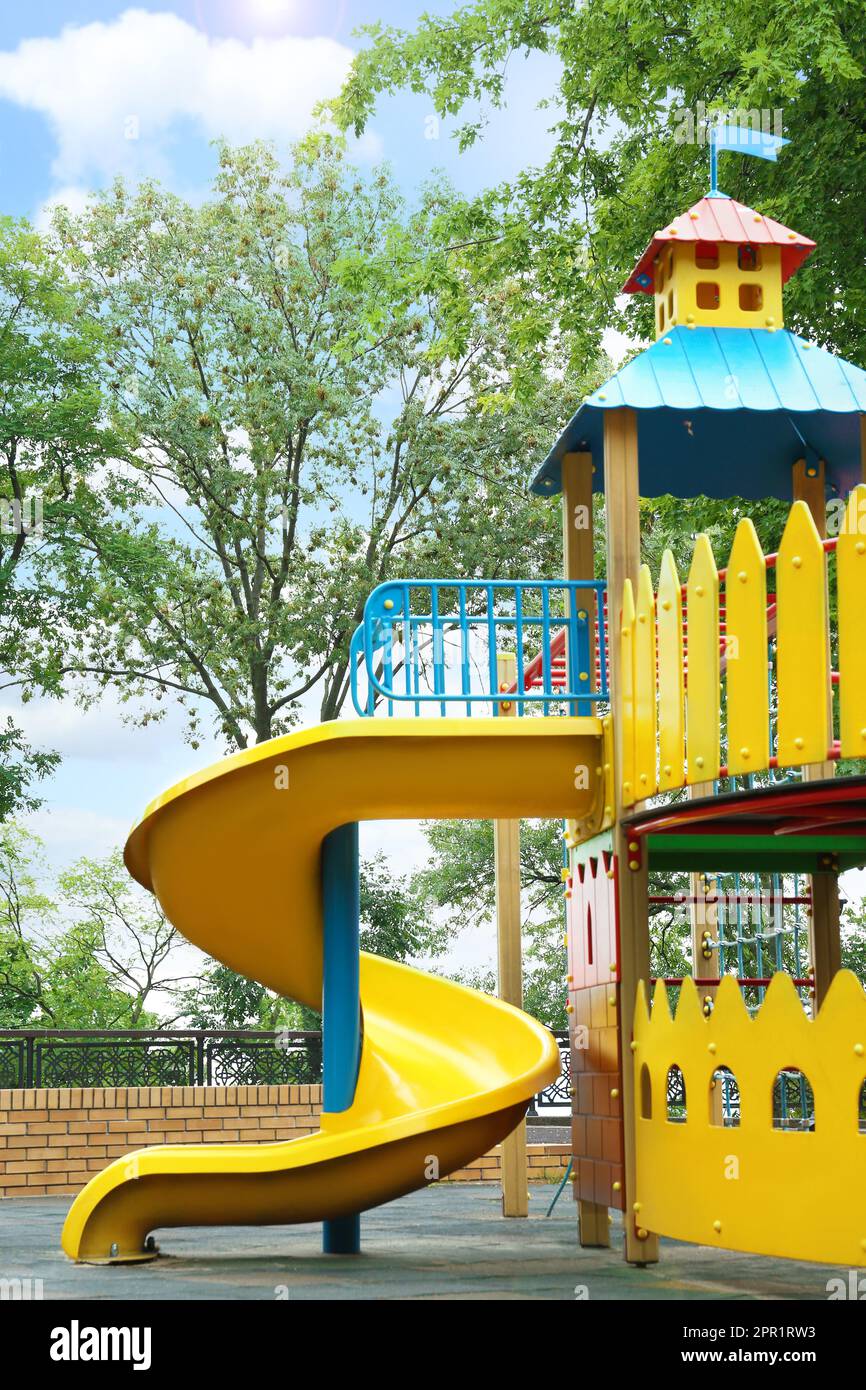 New colorful castle playhouse with slide on children's playground Stock ...