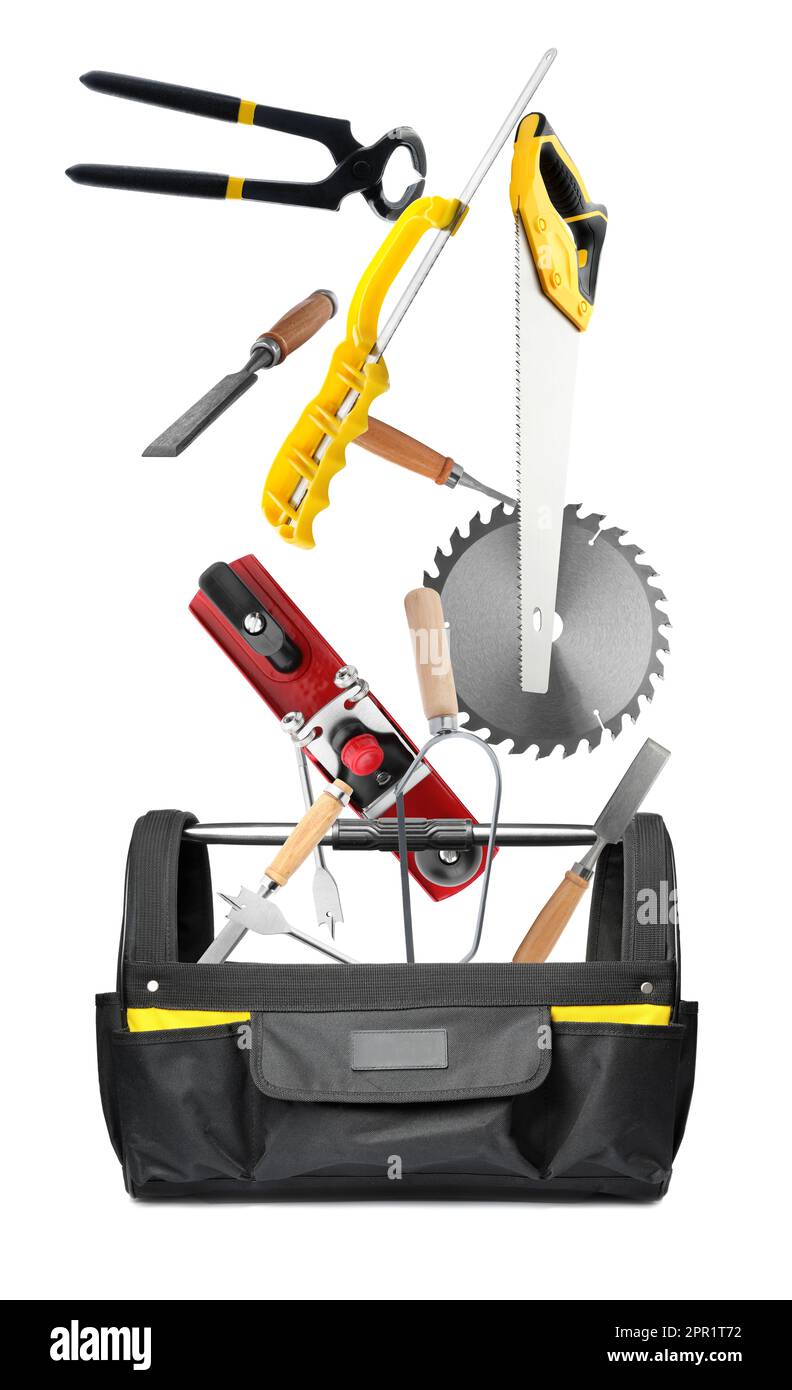 Different carpenter's tools falling into bag on white background Stock ...