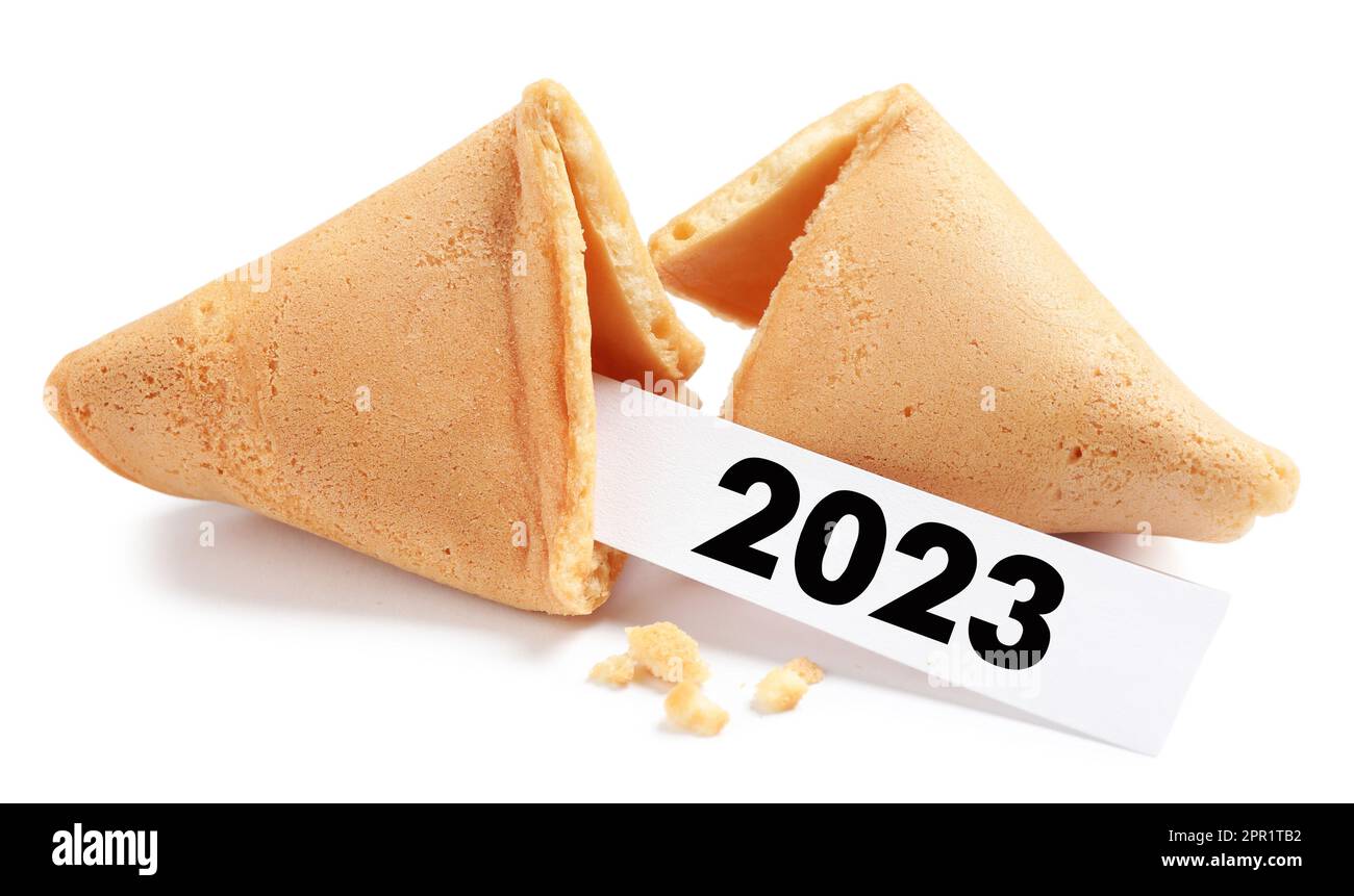 Tasty fortune cookie and paper with number 2023 on white background ...