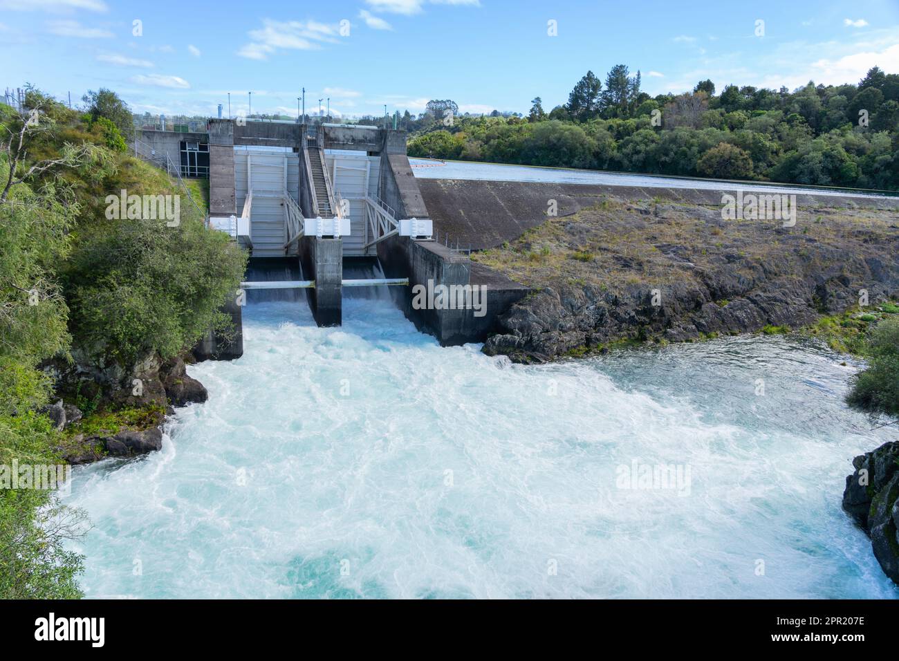 Surging wild white-water flowing through open dam gates at Aratiatia ...