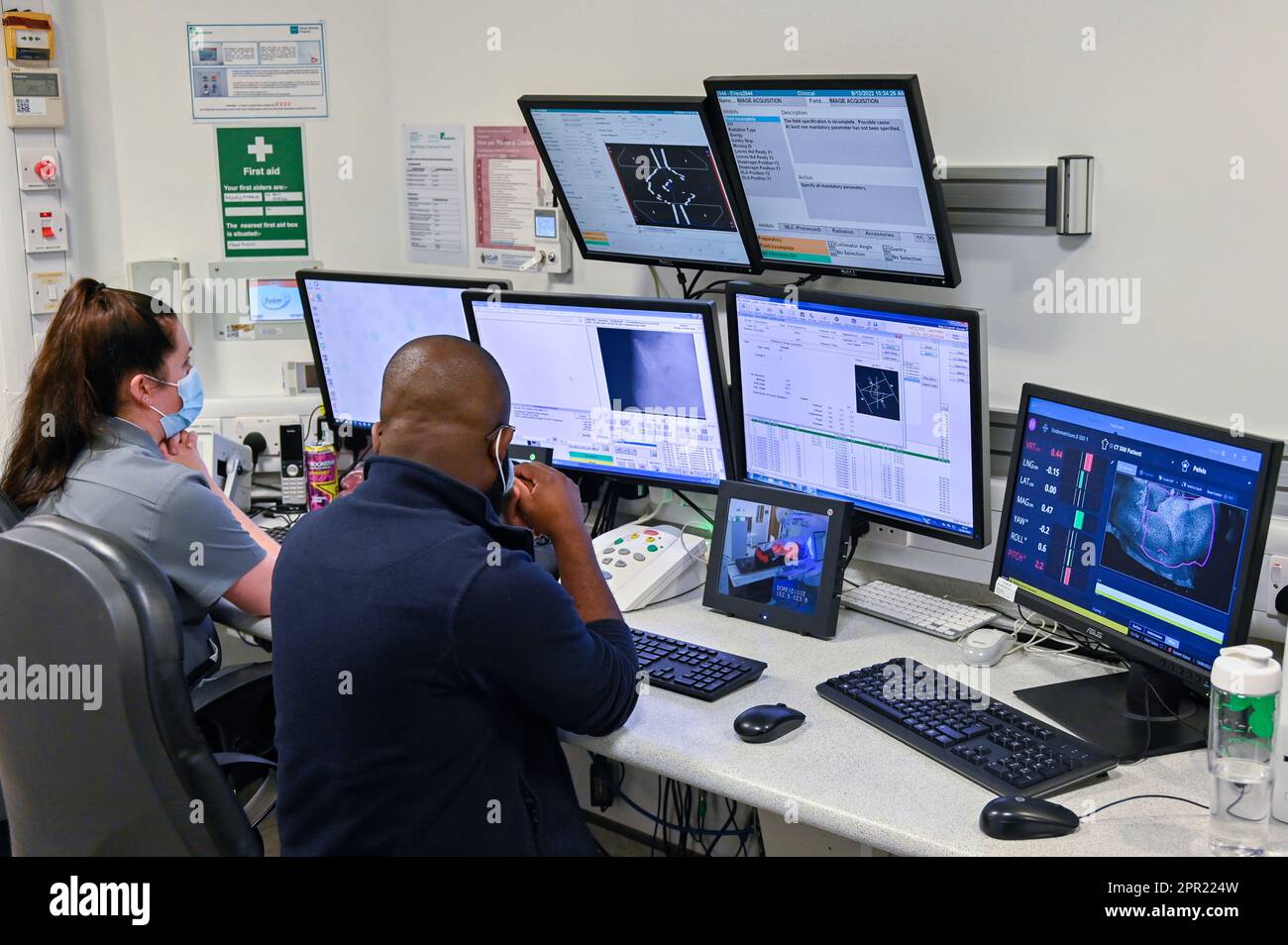 Radiologists monitoring patient undergoing radiotherapy Stock Photo - Alamy