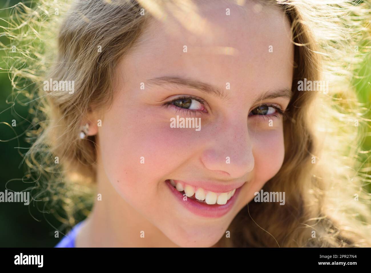Cute little smiling happy girl close up face. Funny kids emotions ...