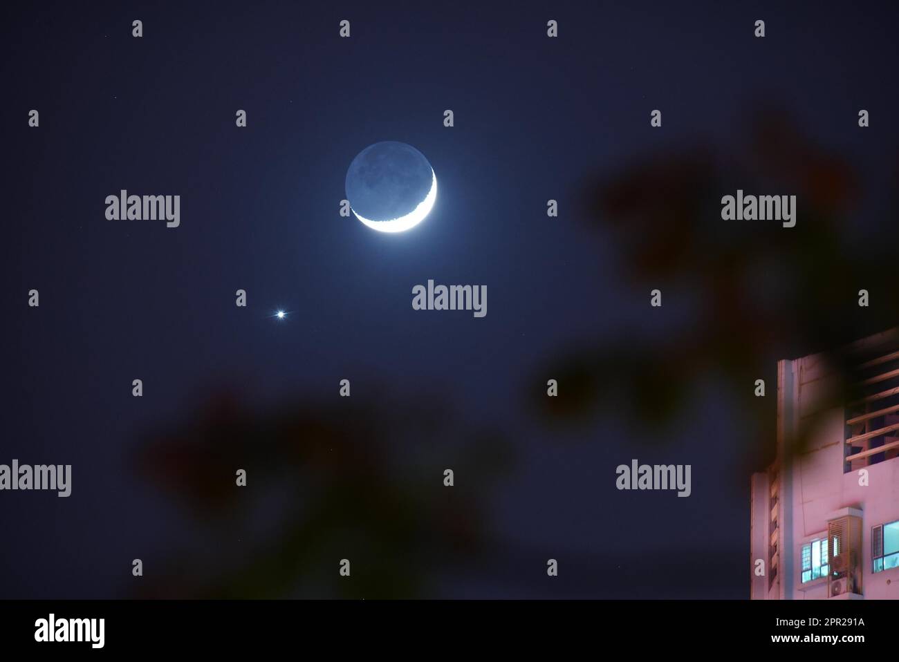 Venus appears in the night sky near a crescent Moon in Korla City of ...