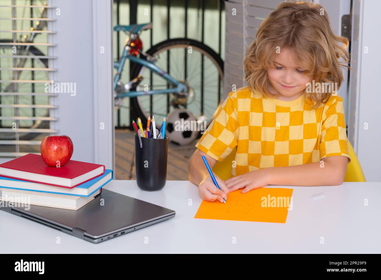 Nerd pupil doing homework writing and reading at home. Clever child ...