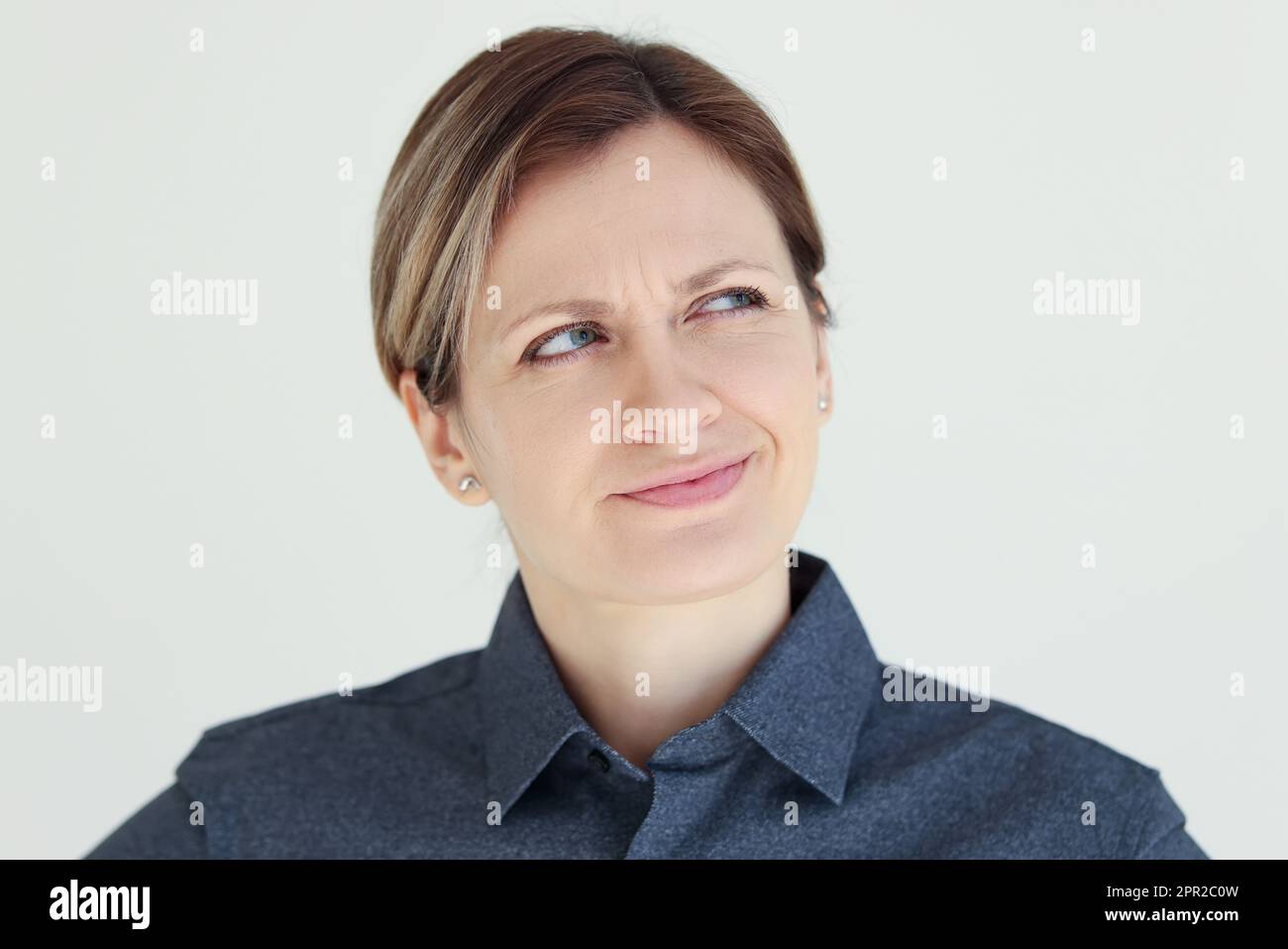 Woman acting suspicious hi-res stock photography and images - Alamy