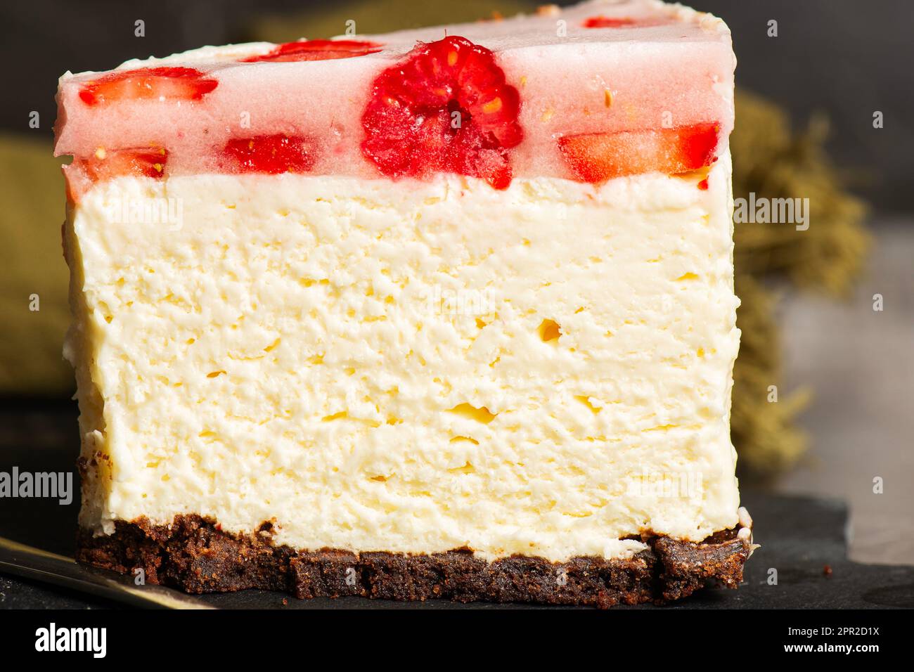 Homemade mixed berry cheesecake with a biscuit crumb and fruit puree ...