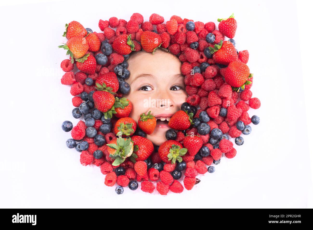 Berry banner. Child face with berries mix of strawberry, blueberry ...