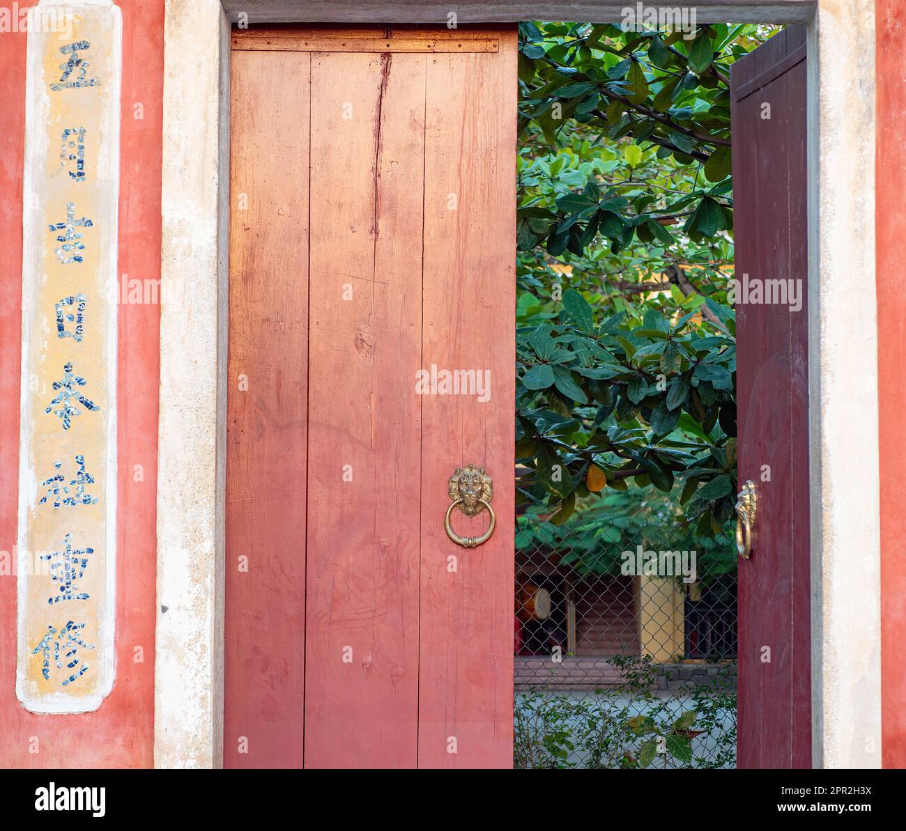 Entrance door of the Ba Mu Temple in Hoi An, Quang Nam province ...