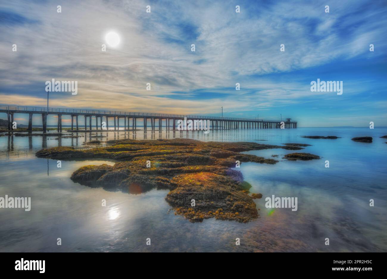 Point Lonsdale Jetty in silhouette, at the entrance to Port Philip Bay ...