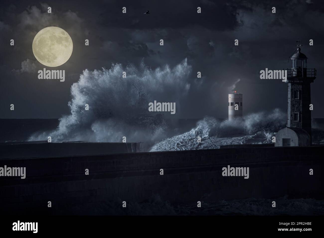 Stormy wave splash in a full moon night Stock Photo - Alamy