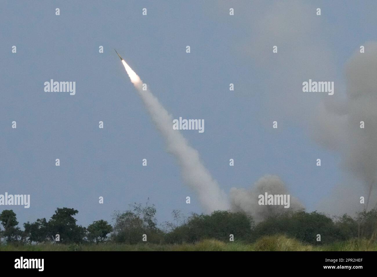 A U.S. M142 High Mobility Artillery Rocket System (HIMARS) fires a ...