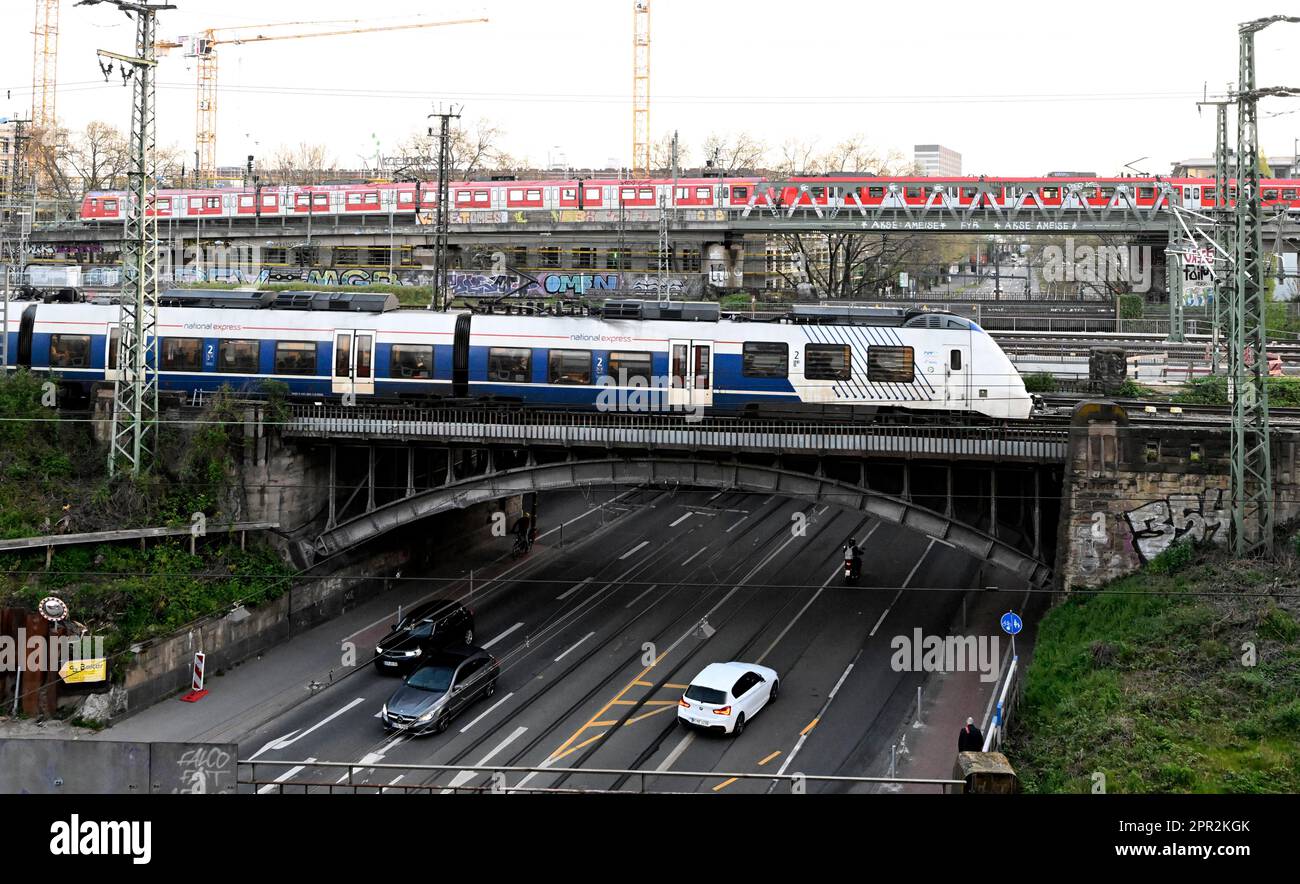 Cologne, Germany. 26th Apr, 2023. Trains cross a railroad bridge early ...