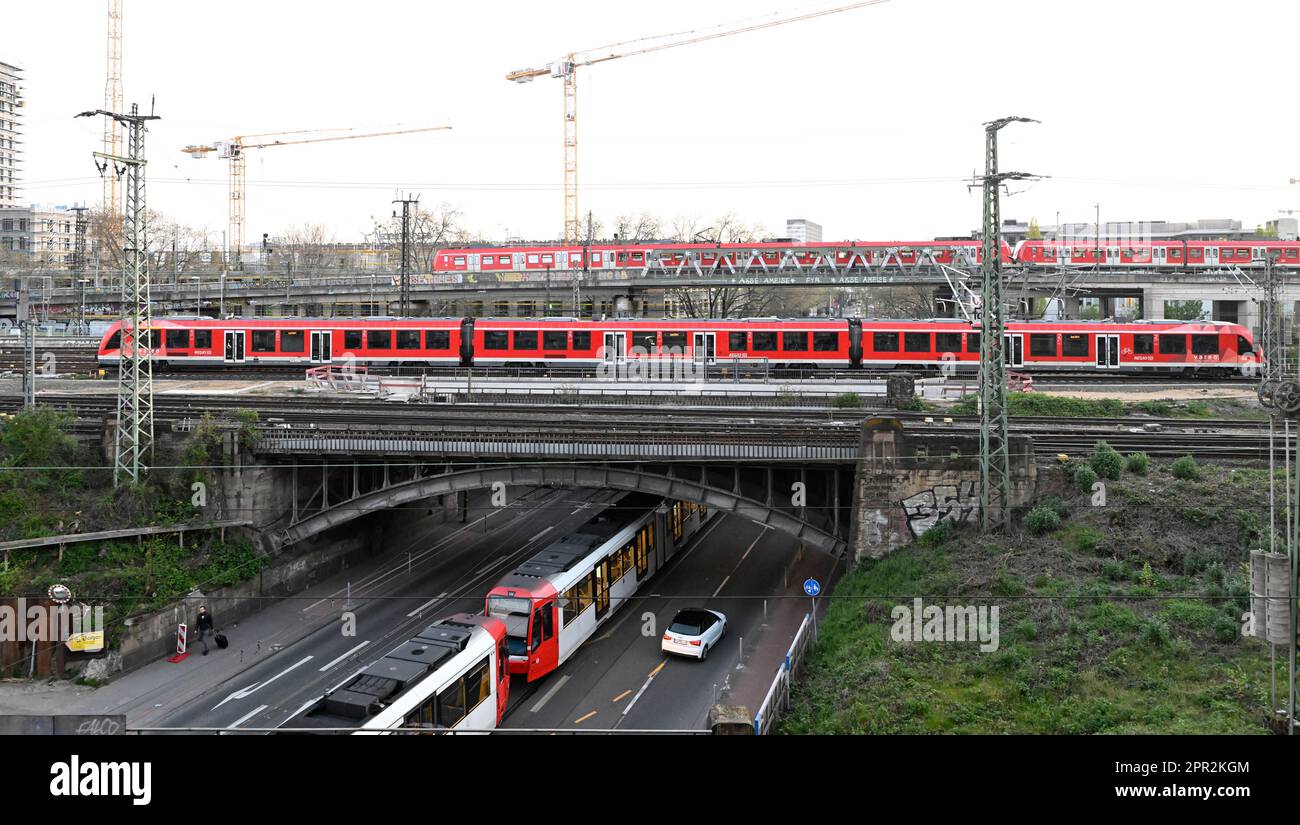 Cologne, Germany. 26th Apr, 2023. Trains cross a railroad bridge early ...