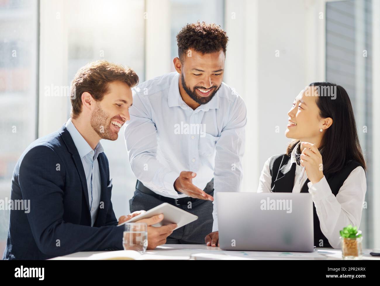 Collaboration, laptop and happy business people discussion ...