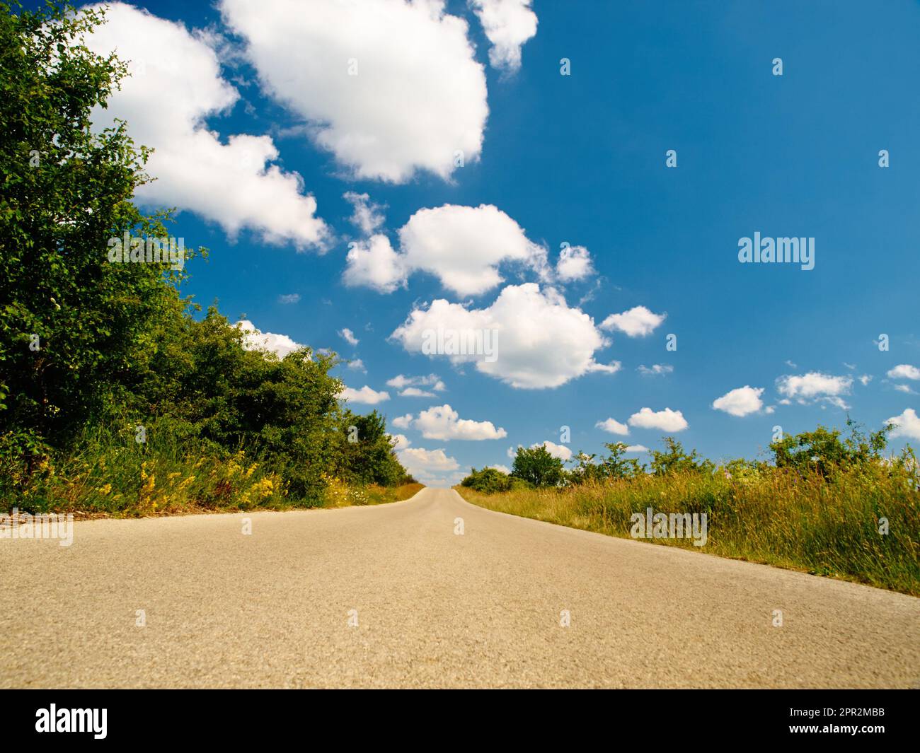 Countryside road, outdoor landscape and sky with clouds, summer ...