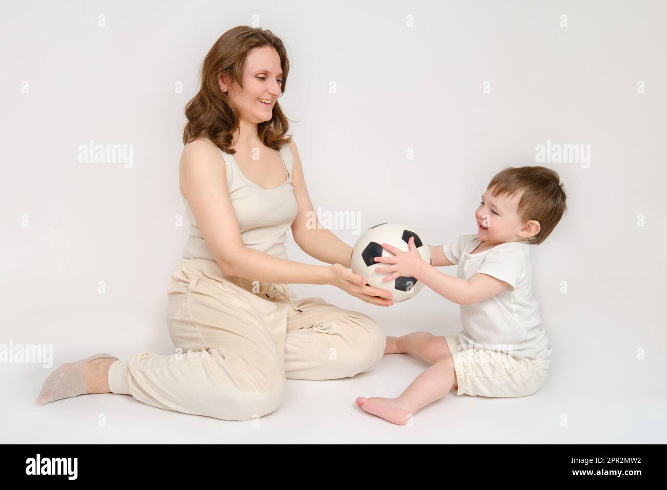 Mom child football game hi-res stock photography and images - Alamy